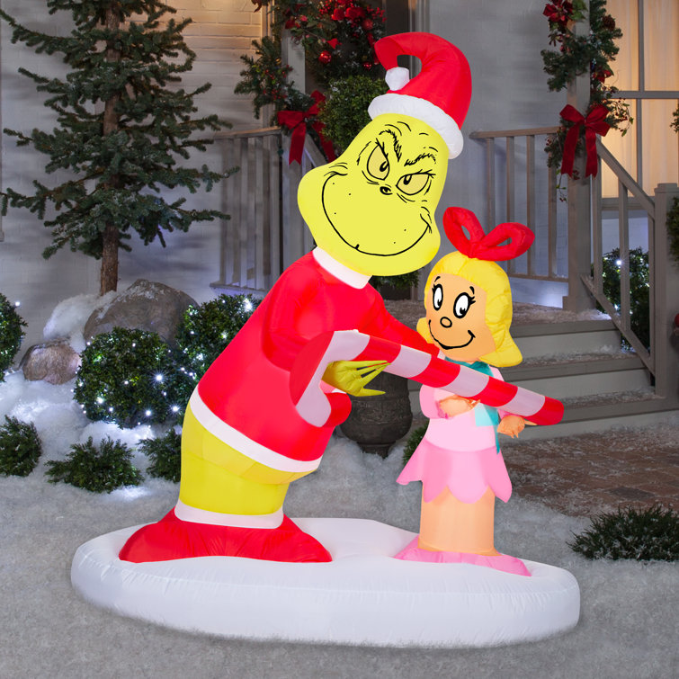Gemmy Industries Airblown Grinch Passing Out Candy Canes To Cindy Lou